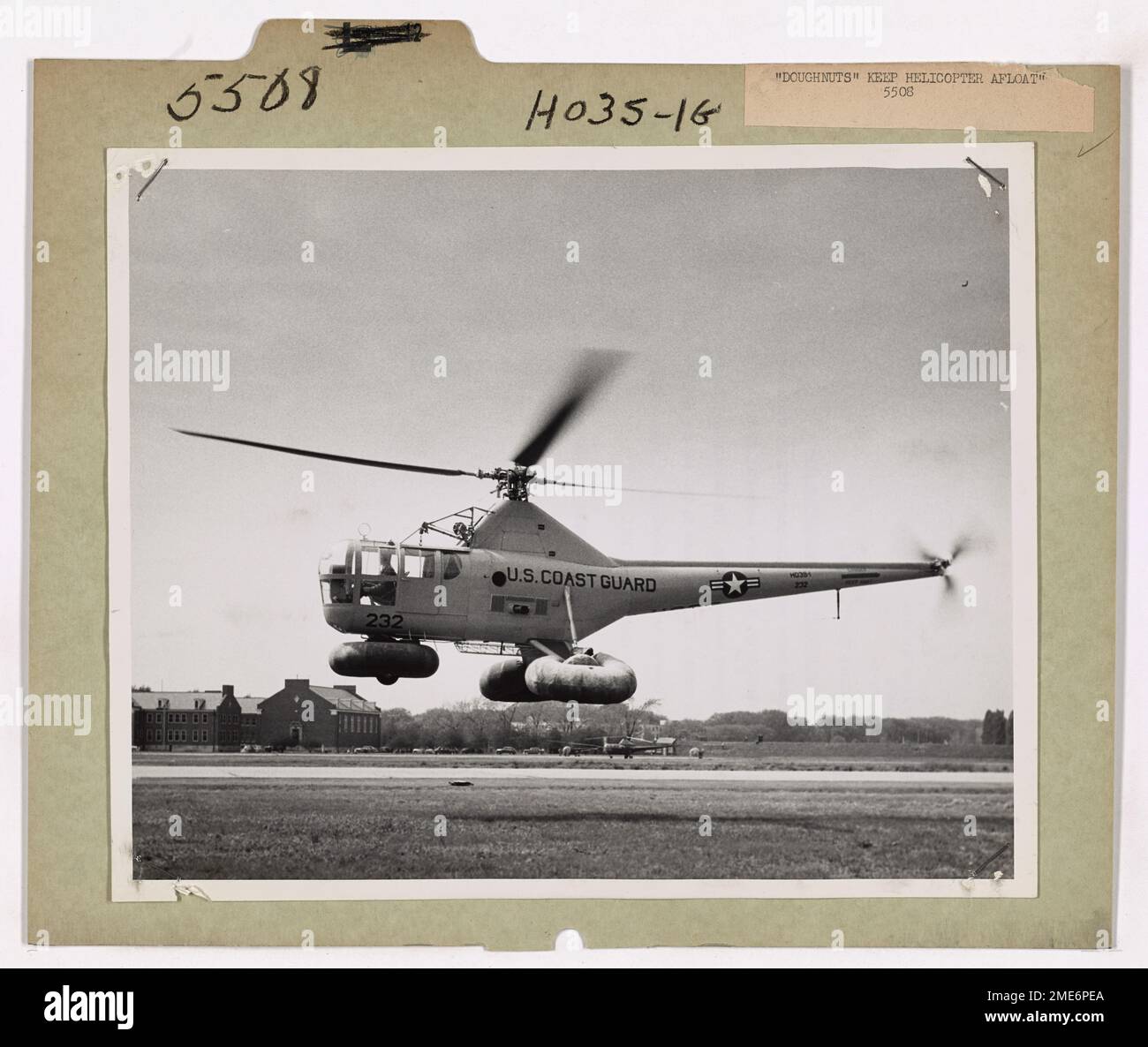 A Coast Guard helicopter demonstrates the use of wheel floats for ...