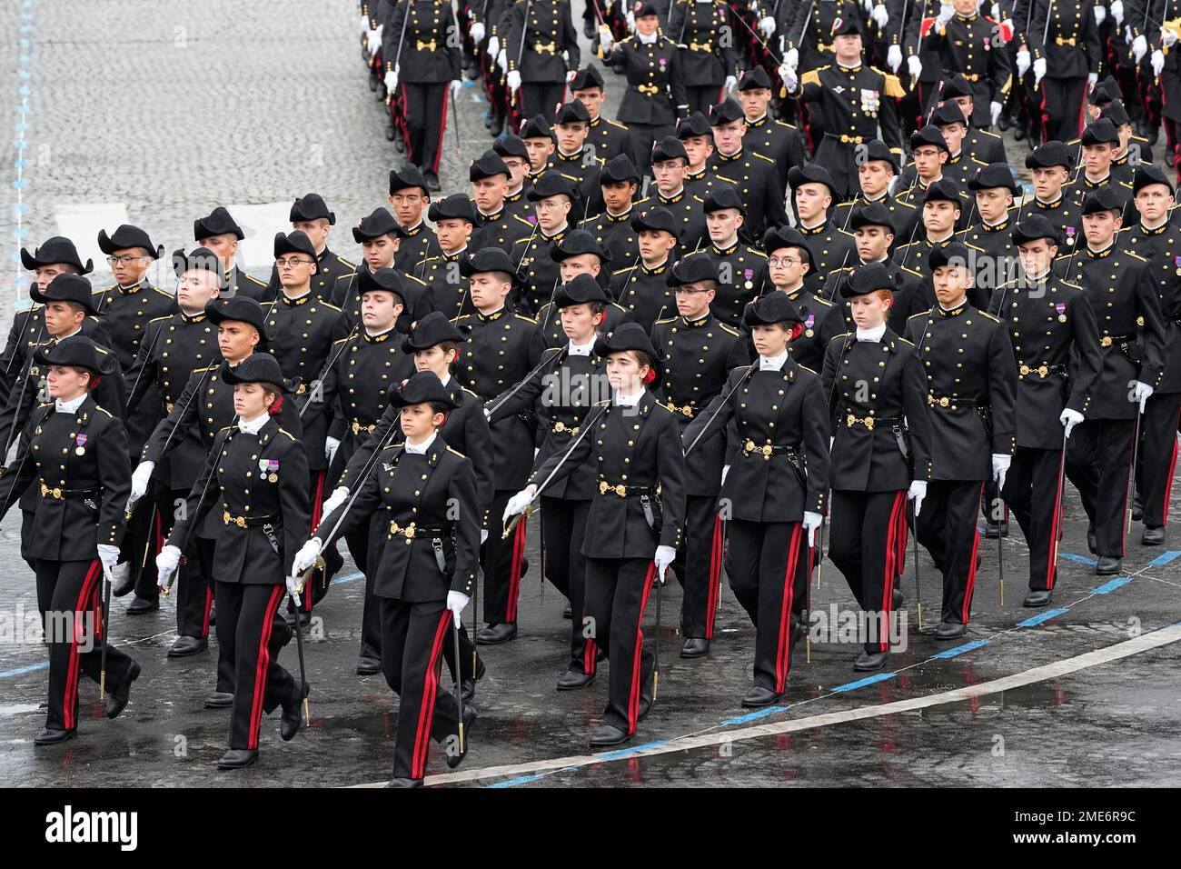 Pupils of Ecole Polytechnique parade on the Champs-Elysees avenue ...