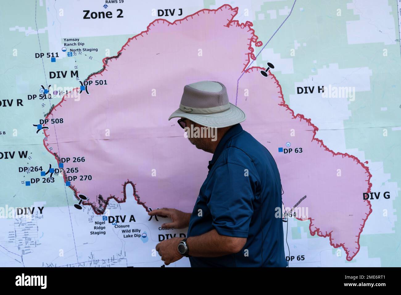 Operations Section Chief Bert Thayer examines a map of the Bootleg Fire ...