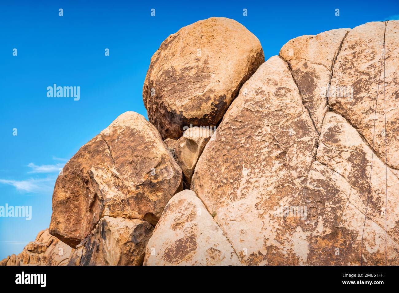 Boulder with climbing rope in Joshua Tree National Park, California ...