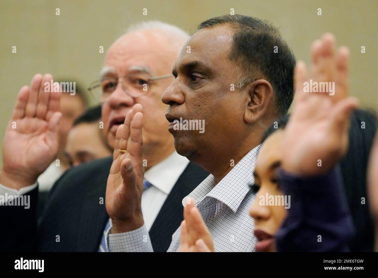 Ramaliggam Konnar, of Malaysia, recites the Oath of Allegiance during ...