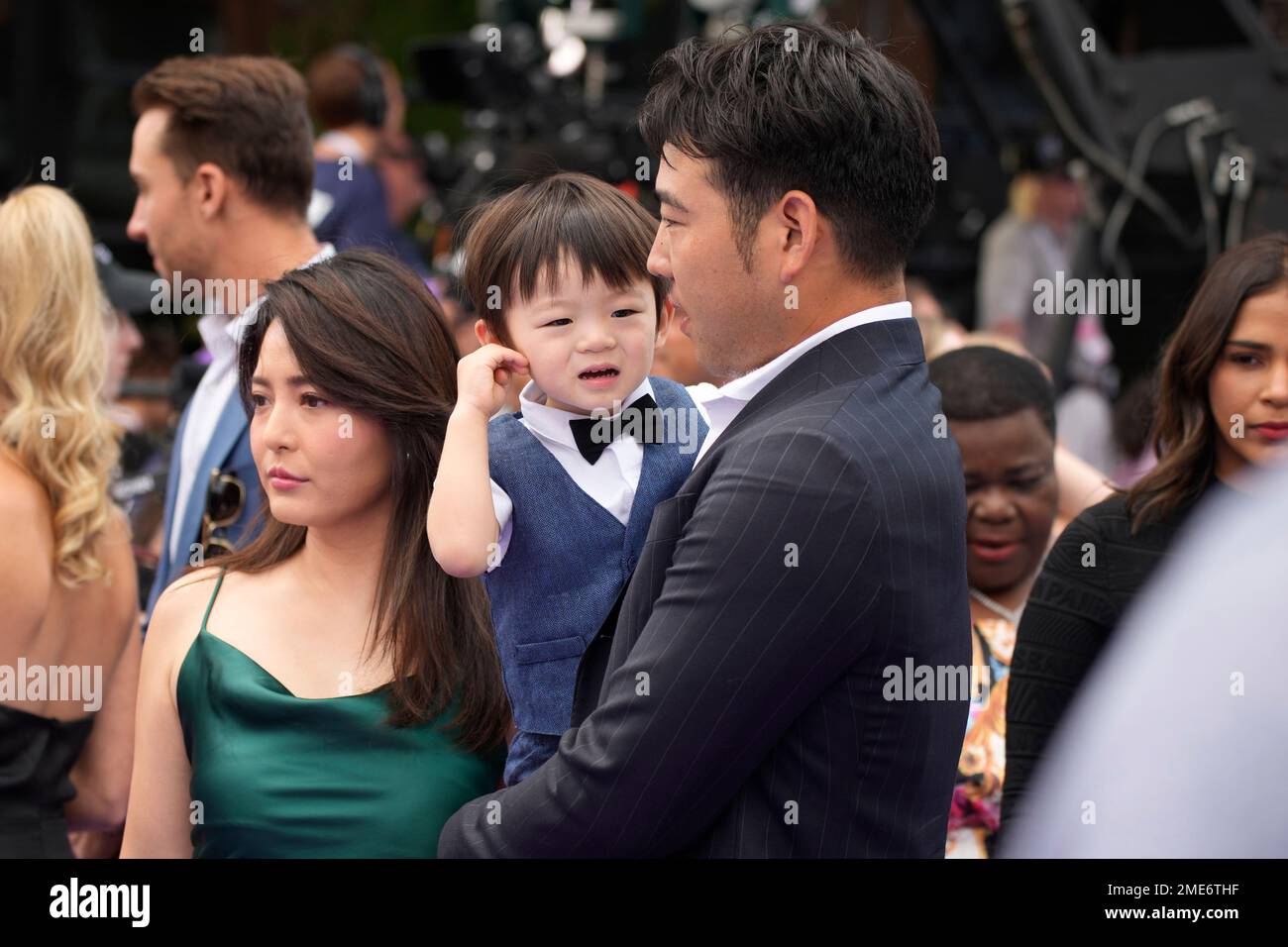 American League's Yusei Kikuchi, of the Seattle Mariners, arrives with is wife Rumi Fukatsu and ...