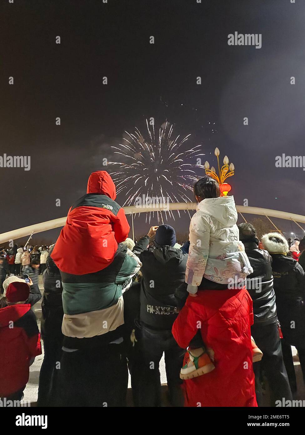 BAZHOU, CHINA - JANUARY 22, 2023 - Residents enjoy a fireworks display ...