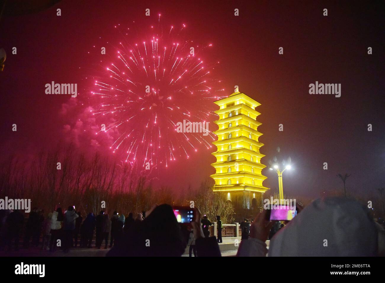 BAZHOU, CHINA - JANUARY 22, 2023 - Residents enjoy a fireworks display ...
