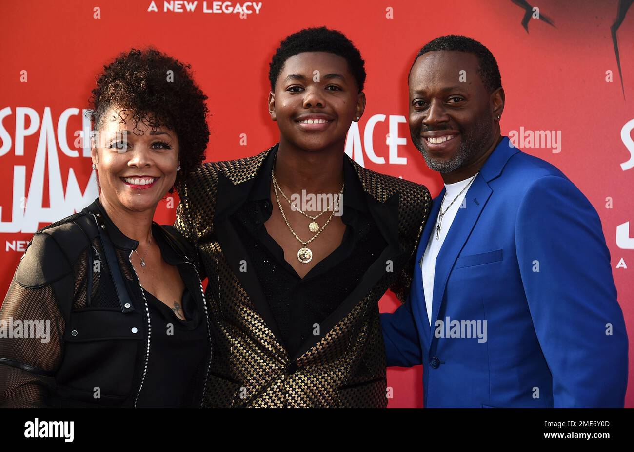 Cedric Joe, center, arrives with his parents at the world premiere of ...