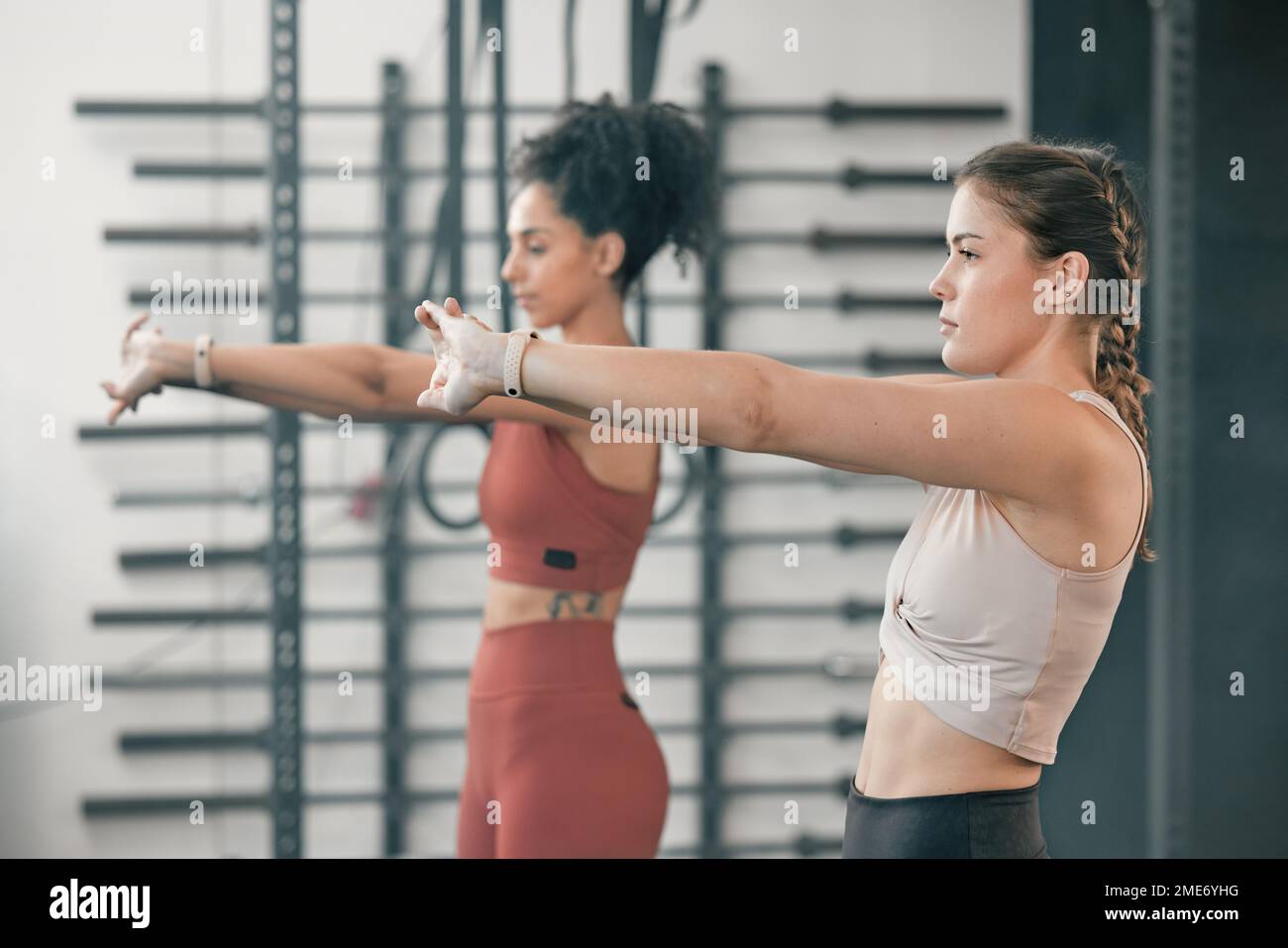Fitness, stretching and arms with women in gym for training, workout ...