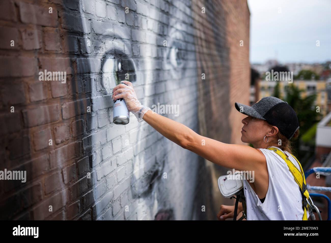 Spanish street artist Lula Goce works in a giant mural in Brussels ...