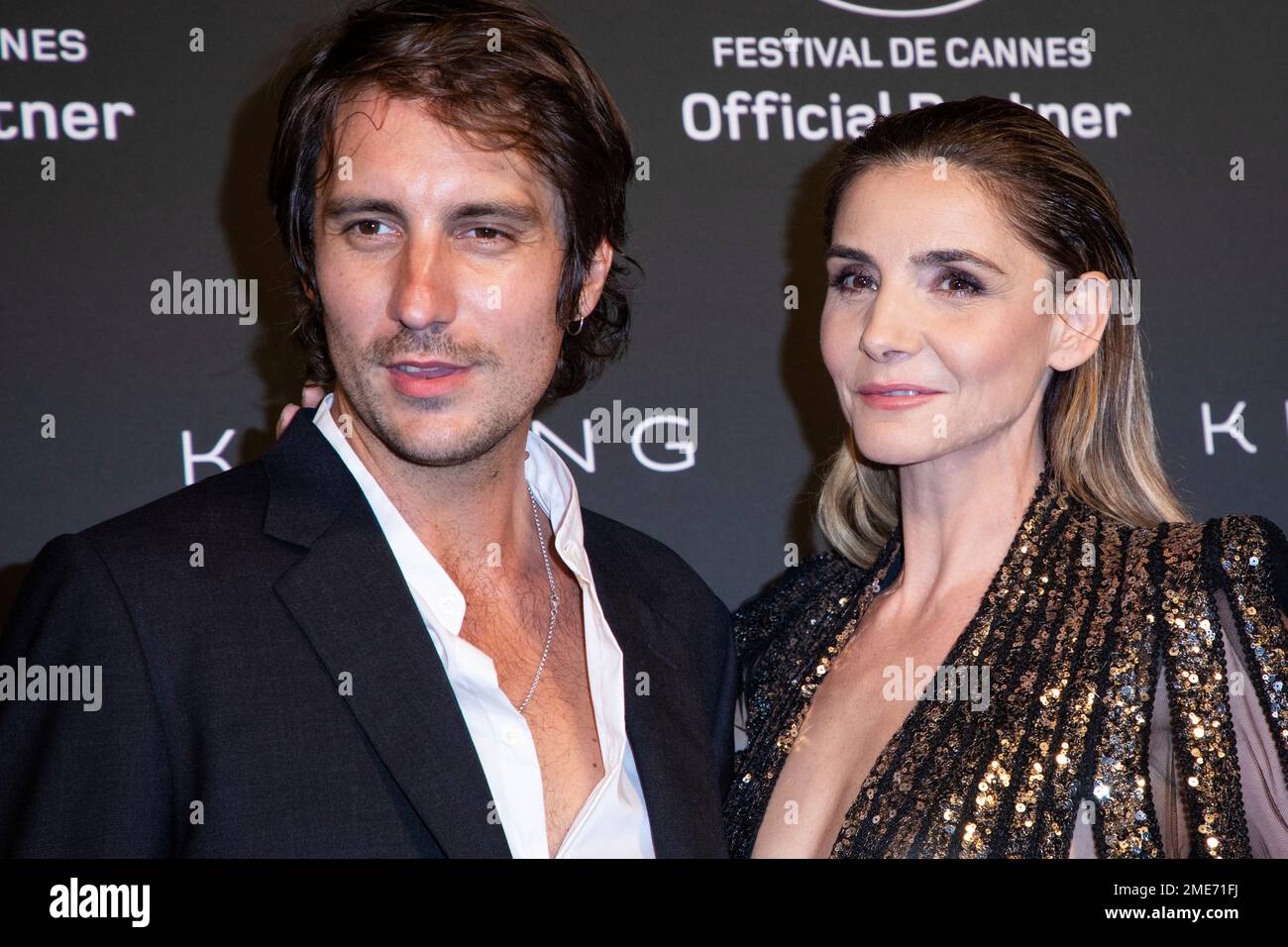 Maxime Roy and Clotilde Courau pose for photographers upon arrival at ...