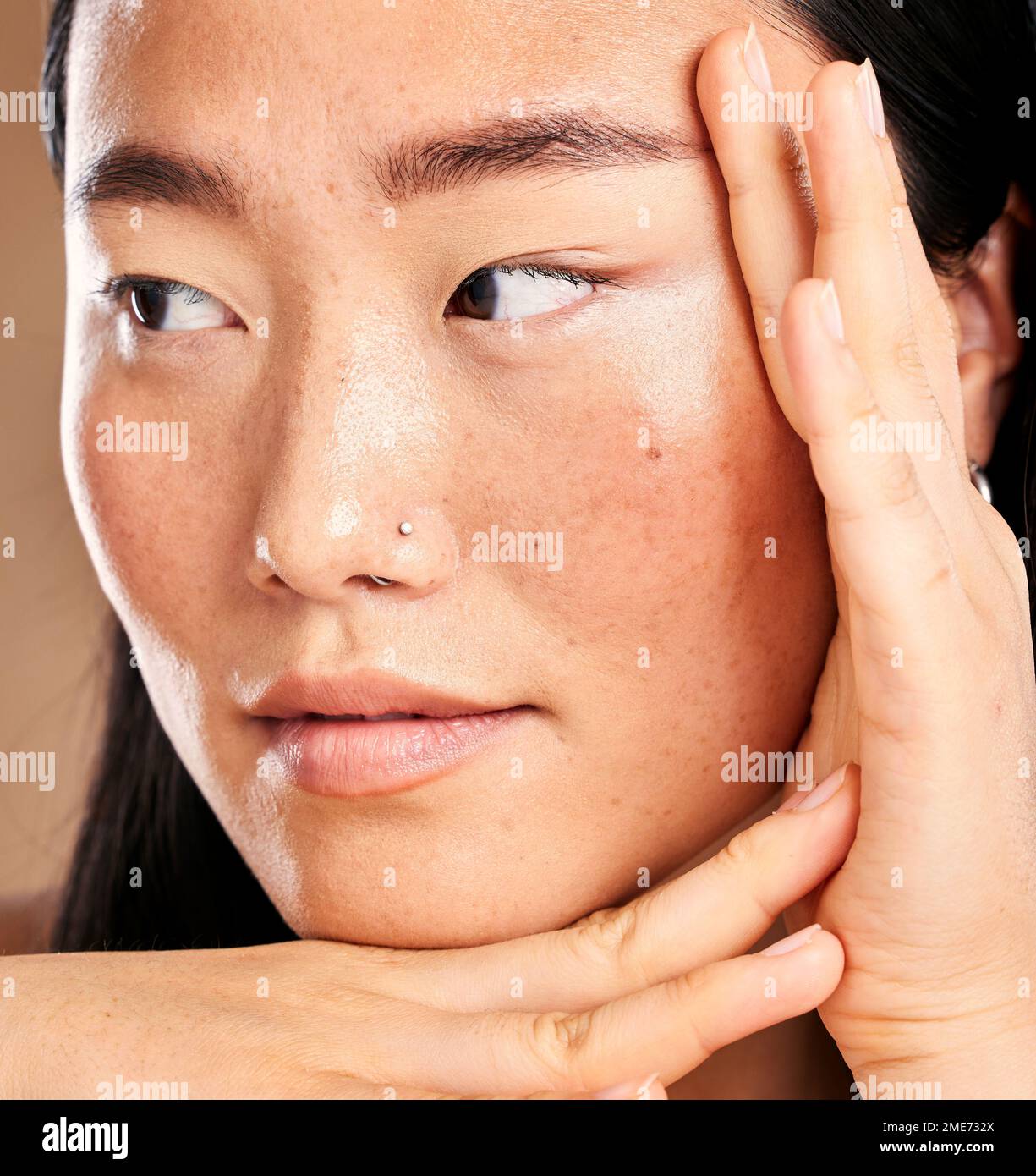 Closeup face, hand frame and asian woman in studio with skincare, skin ...