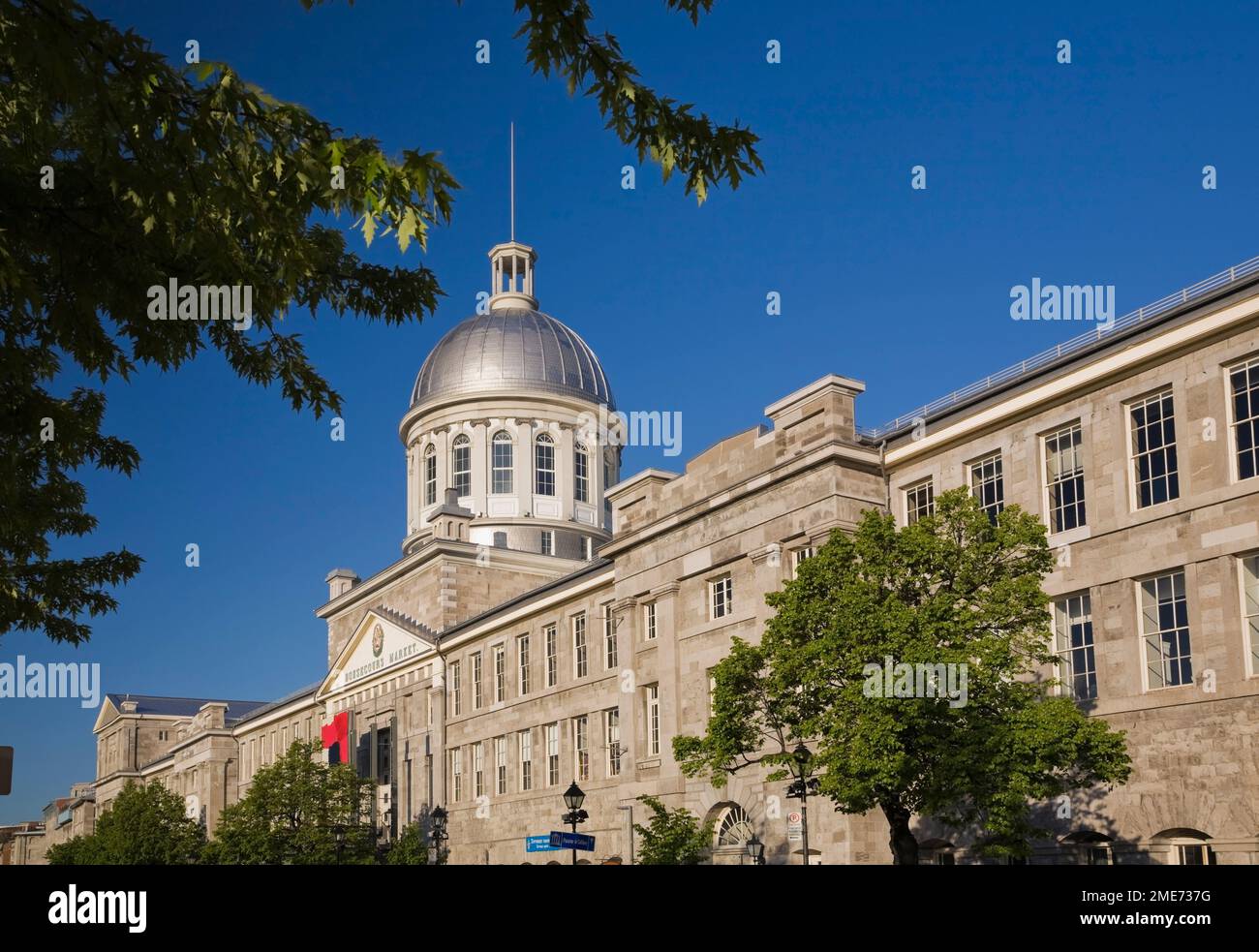 Bonsecours Market building through deciduous trees in spring, Old ...