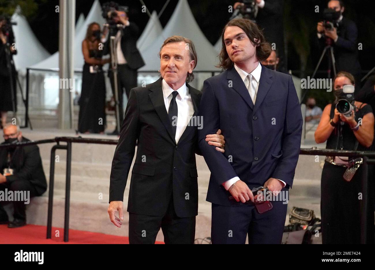 Tim Roth, left, and Michael Cormac Roth pose for photographers upon ...
