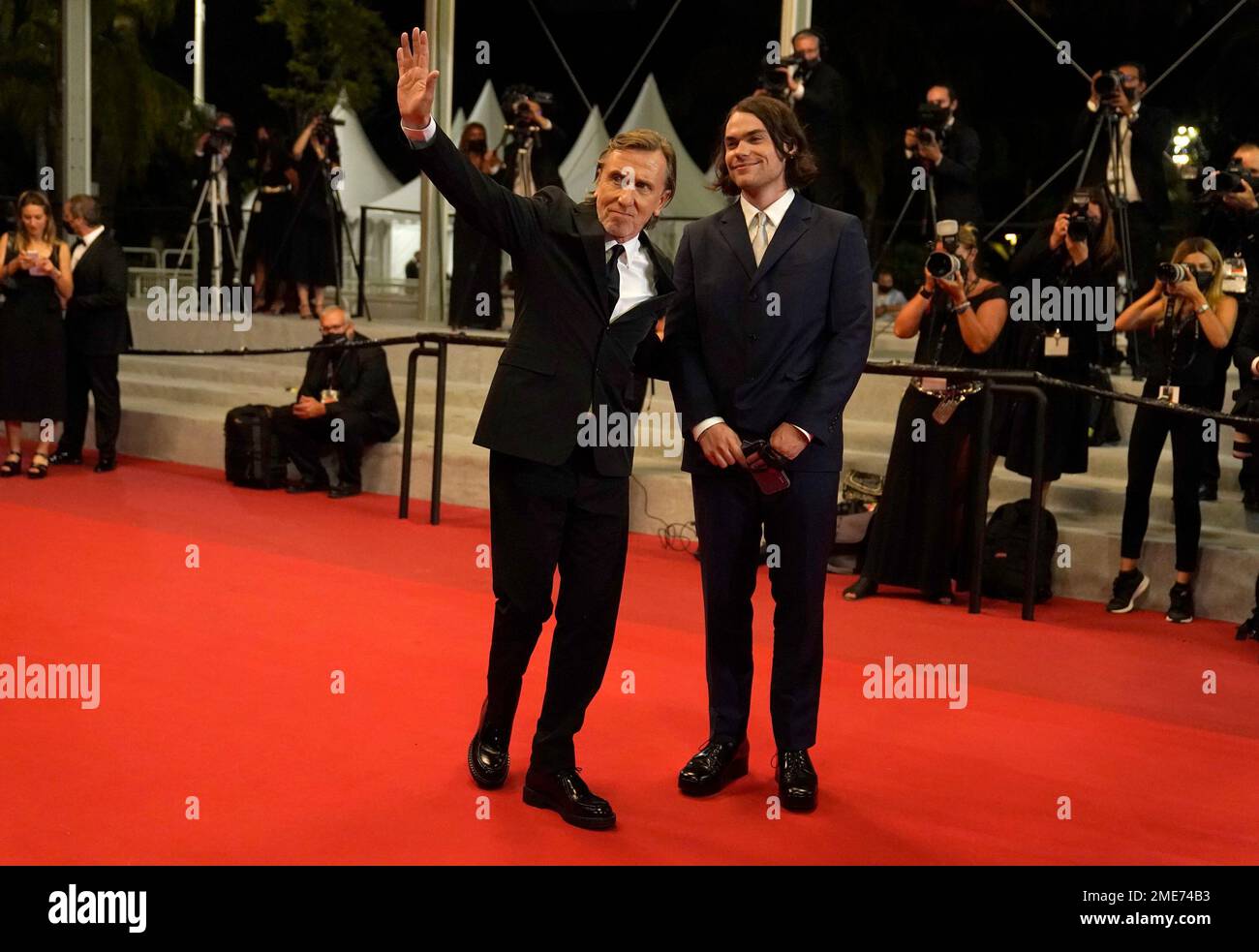 Tim Roth, left, and Michael Cormac Roth pose for photographers upon ...