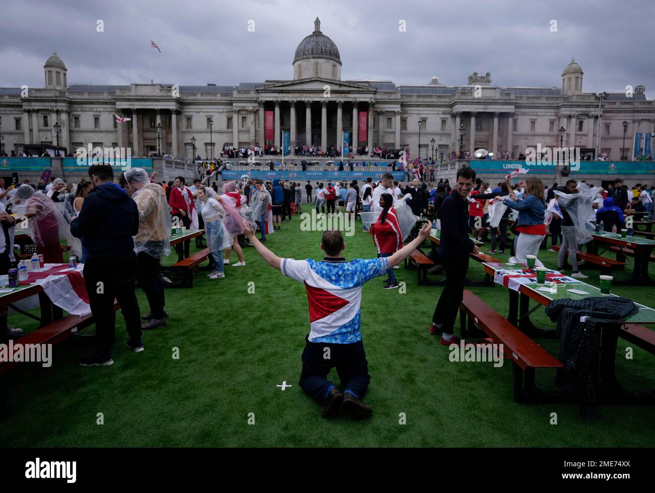 Fans gather in the designated fan zone at Trafalgar Square in London ...