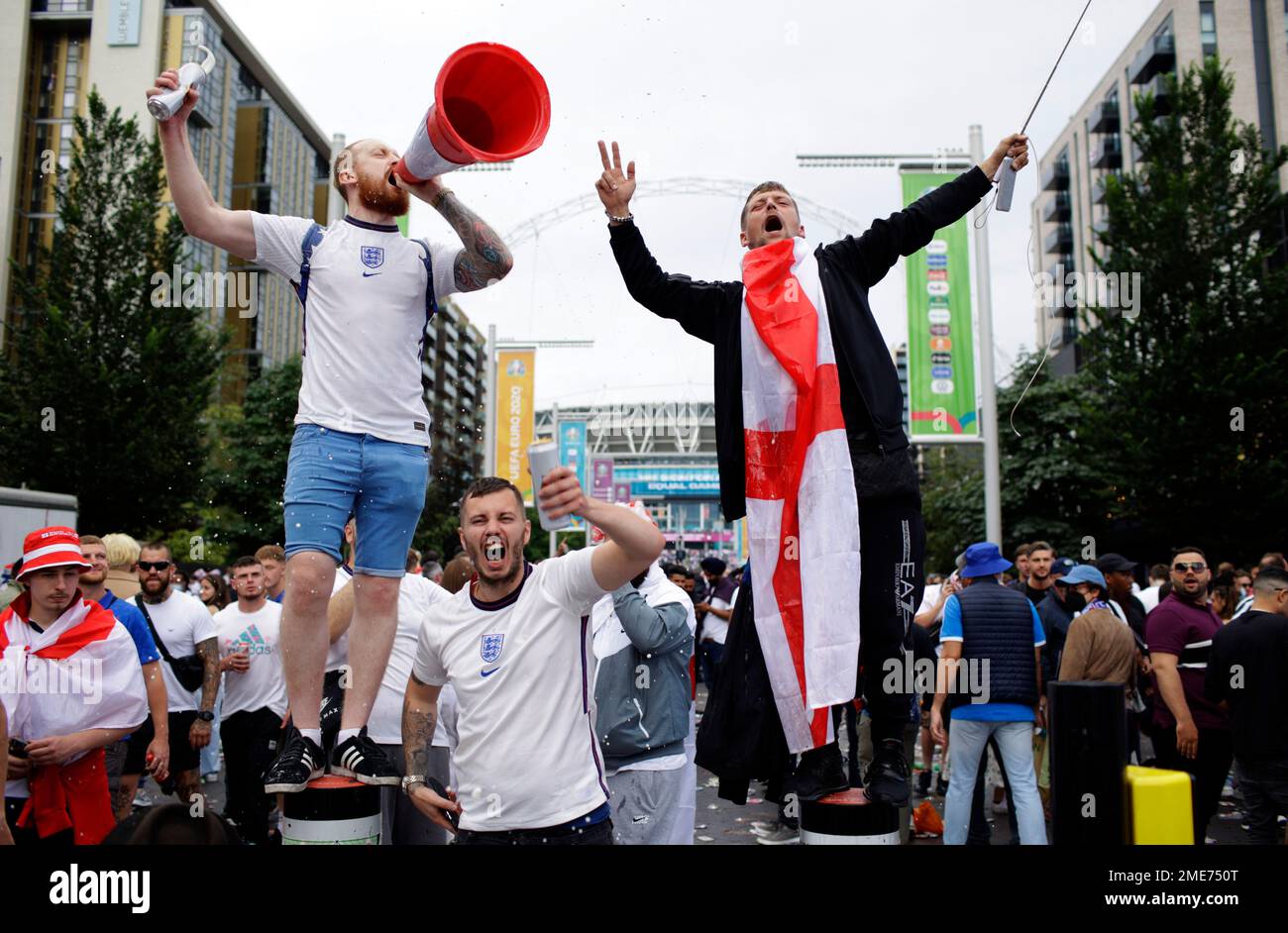 Two England fans shout with a traffic cone outside Wembley Stadium in ...