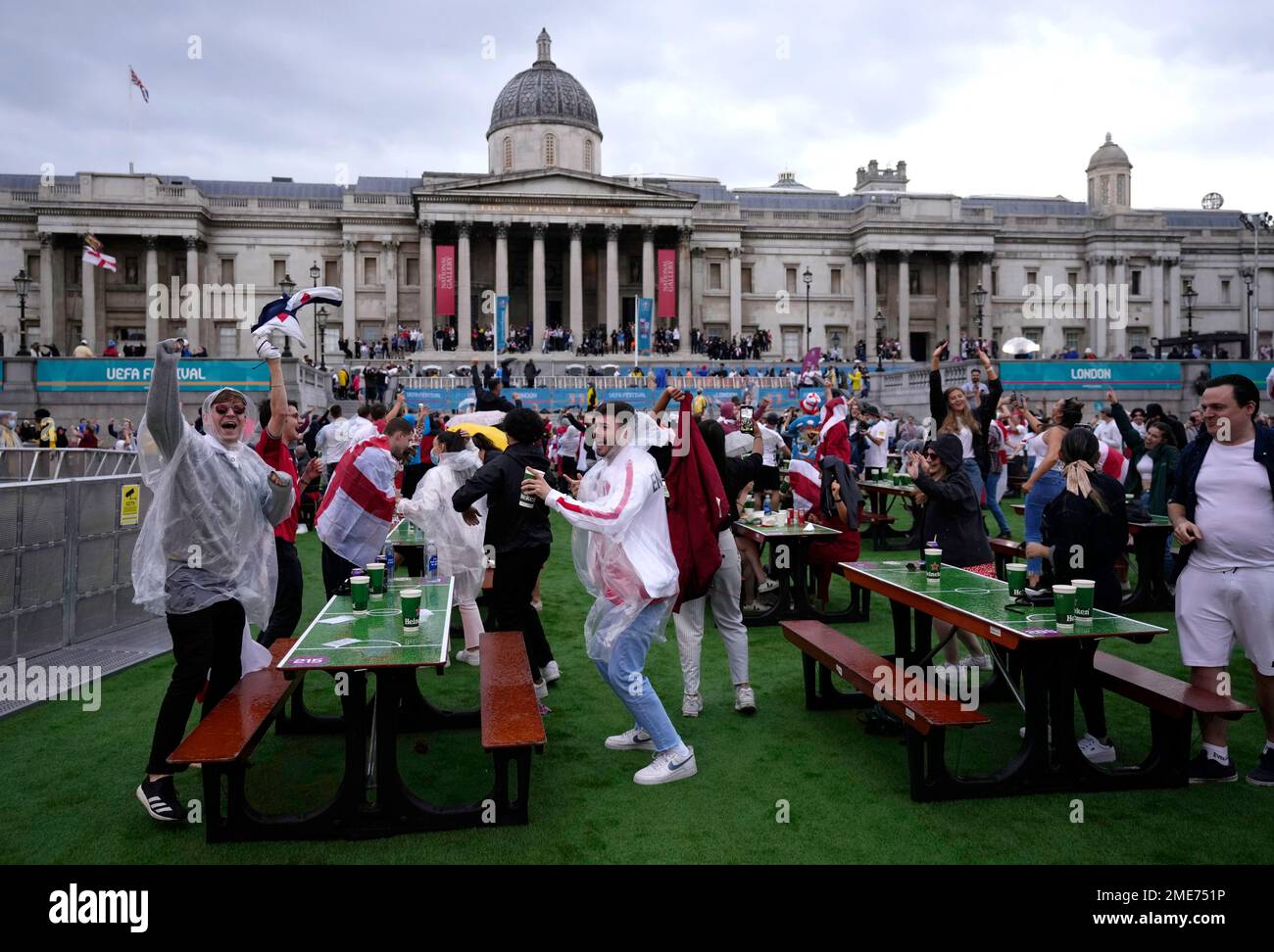 Fans cheer as they gather in the designated fan zone at Trafalgar ...