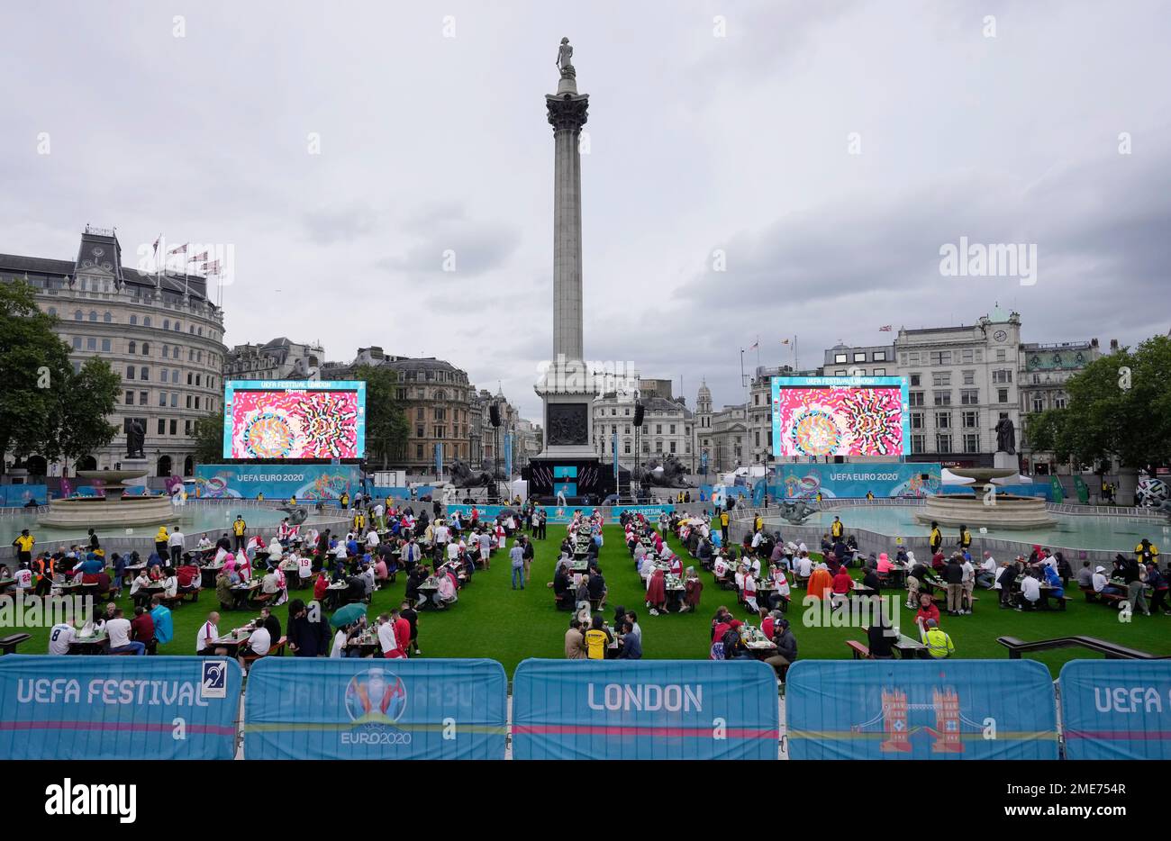 Fans gather at tables in the fan zone at Trafalgar Square in London ...