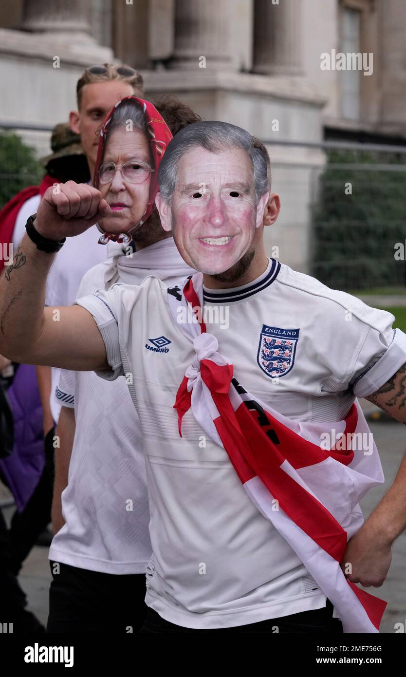 Two England fans wear masks with the likeness of Britain's Prince ...