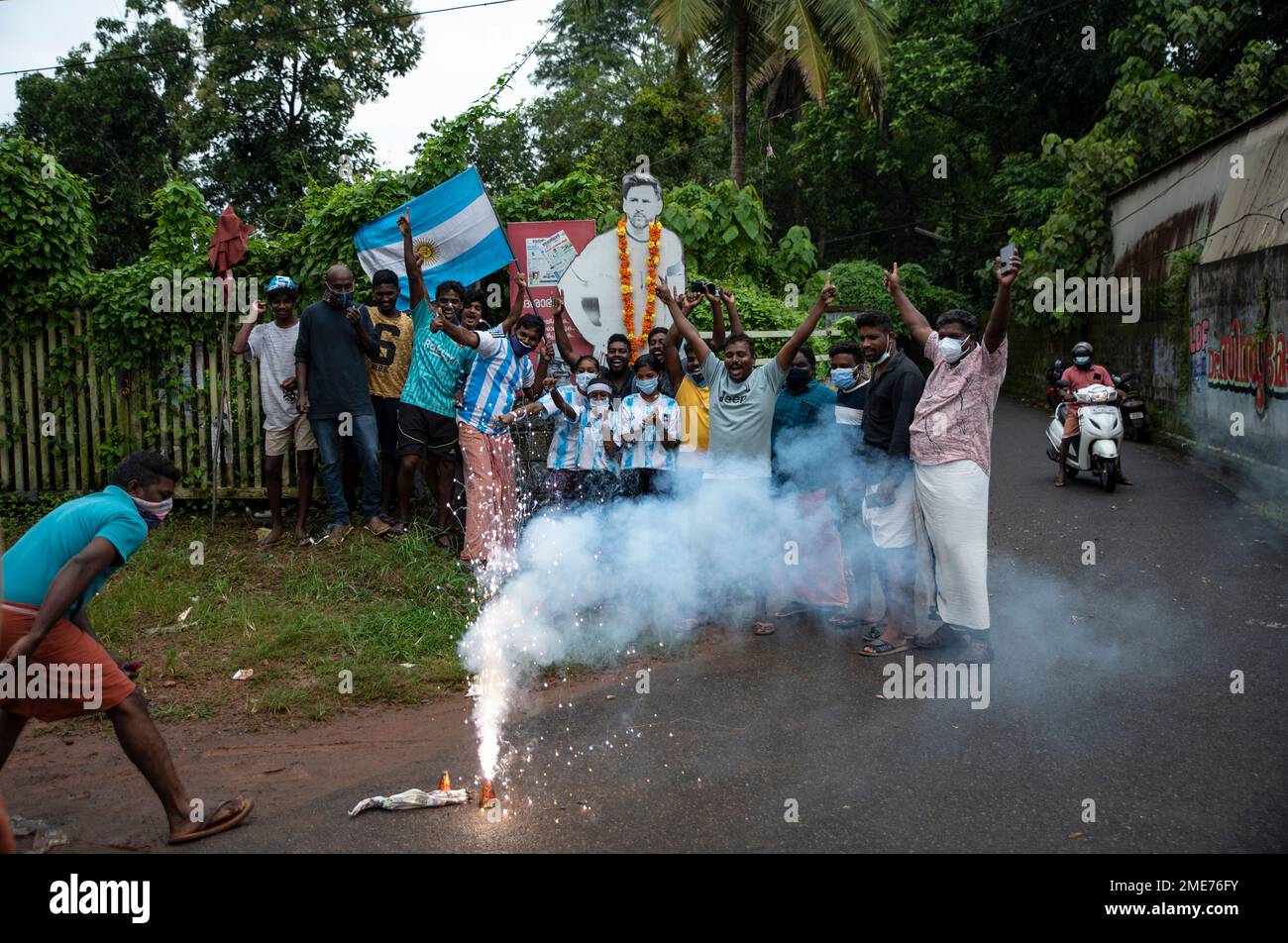 Indian soccer fans garland a cut out photograph of Argentina's Lionel ...