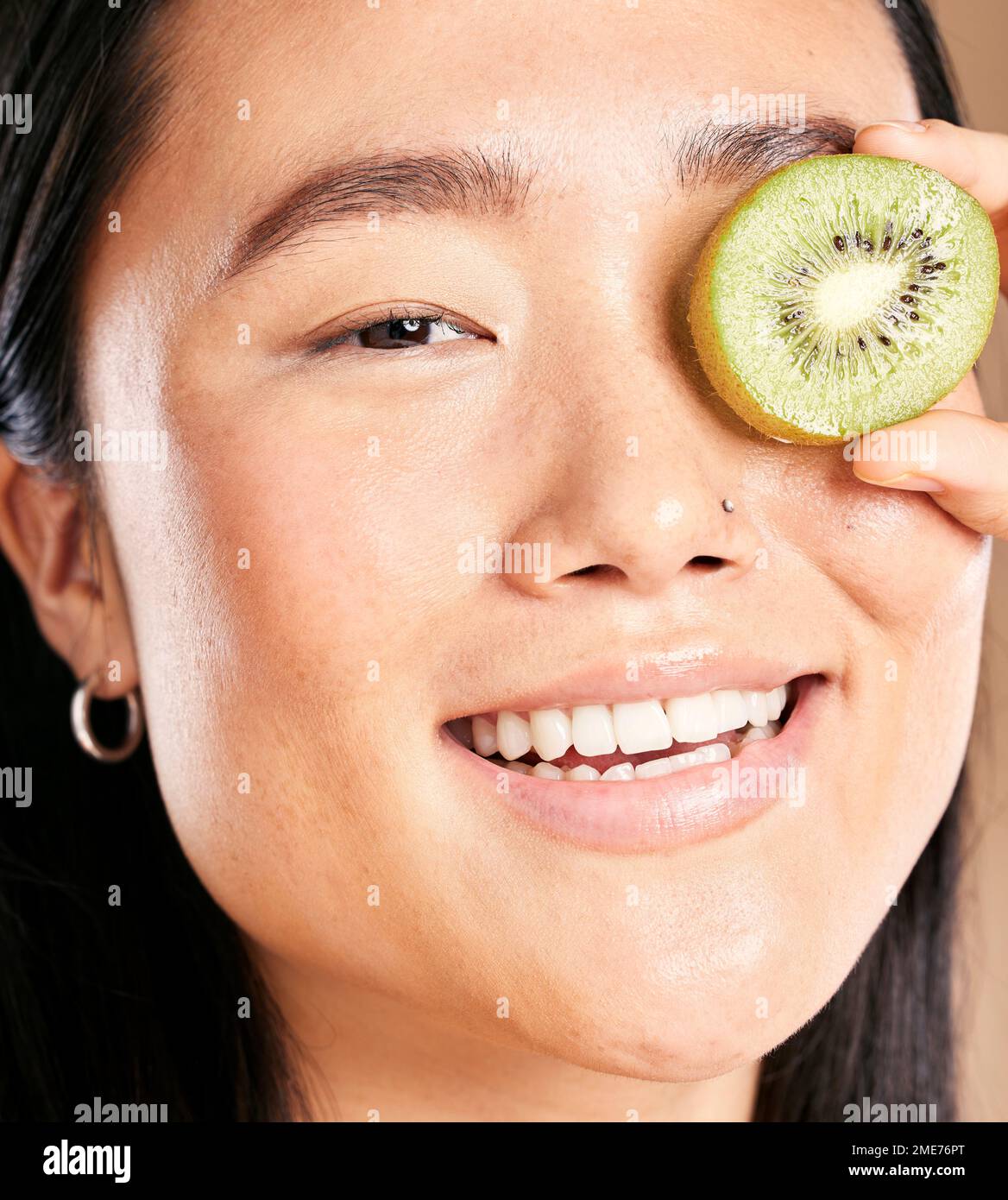 Asian woman, smile and kiwi skincare portrait for facial skincare ...
