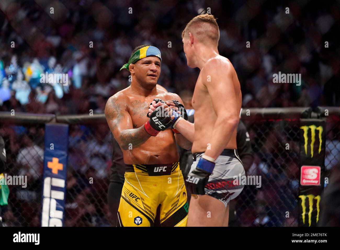 Gilbert Burns, left, shakes hands with Stephen Thompson after a UFC 264 ...