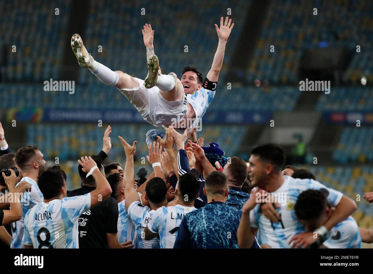 Teammates lift Argentina's Lionel Messi after beating Brazil 1-0 in the ...
