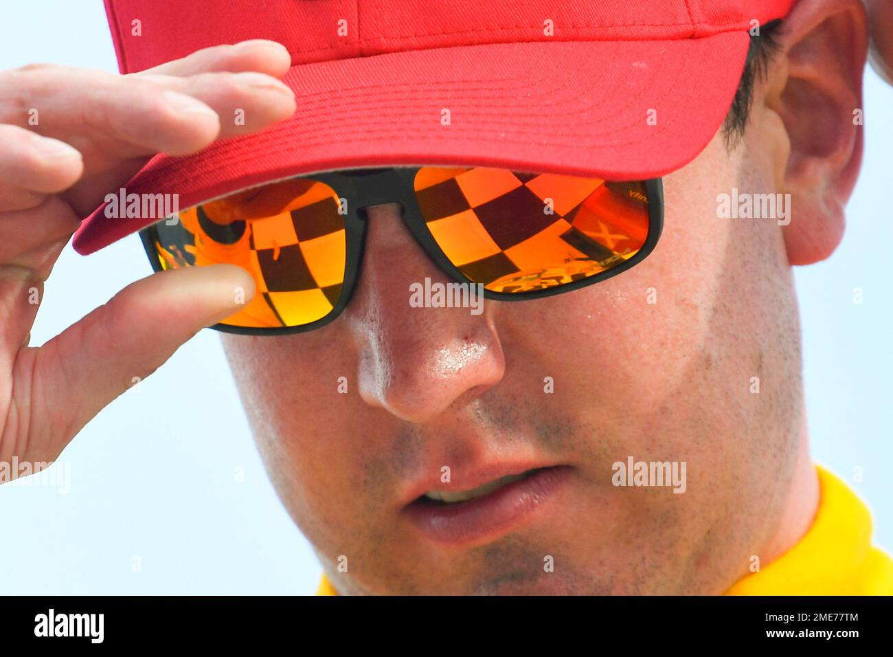 Kyle Busch puts on a cap while in Victory Lane after wining the NASCAR ...