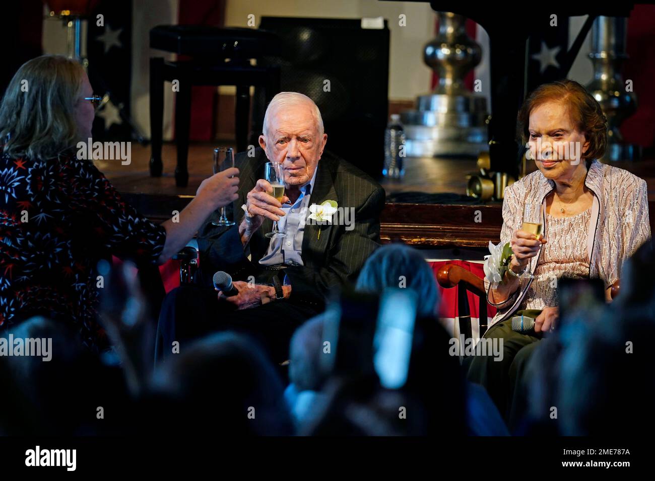 Amy Carter, left, rises her glass during a toast to her parents former ...