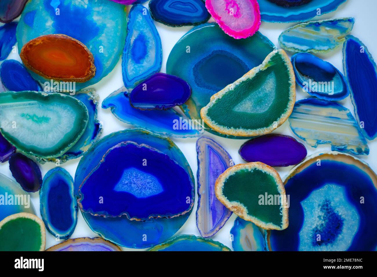 Agate geode crystal. Agates set in blue and green colors.slices of ...