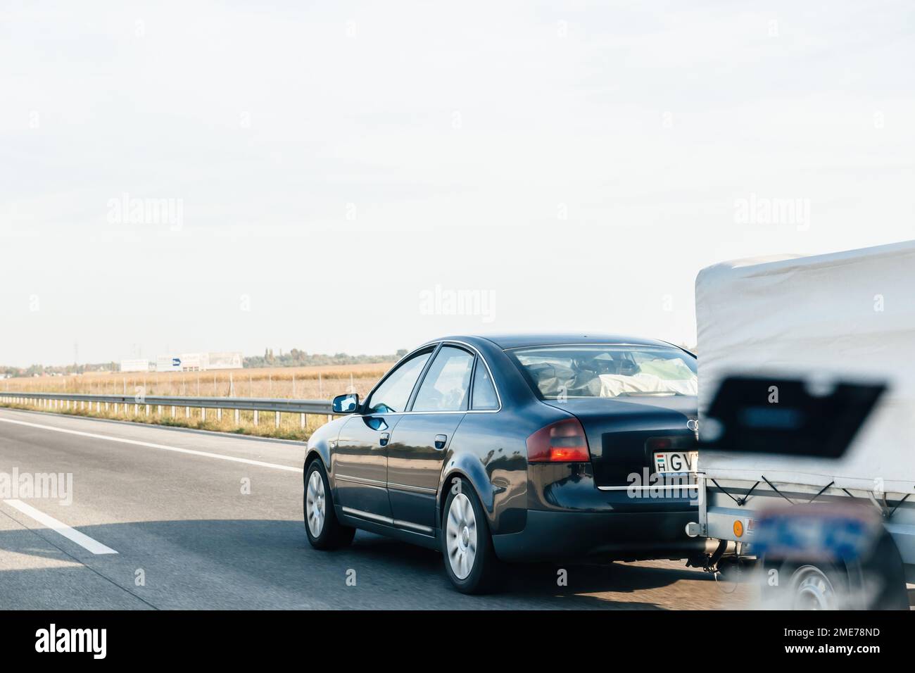 Hungary - Sep 20, 2014: Side view of driving fast luxury black Audi ...