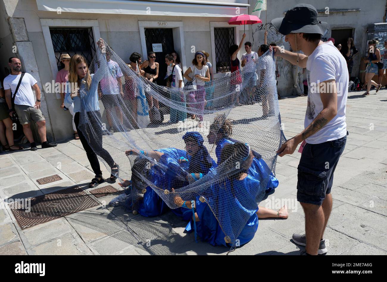 Participants in fish costumes perform on a protest event of the ...