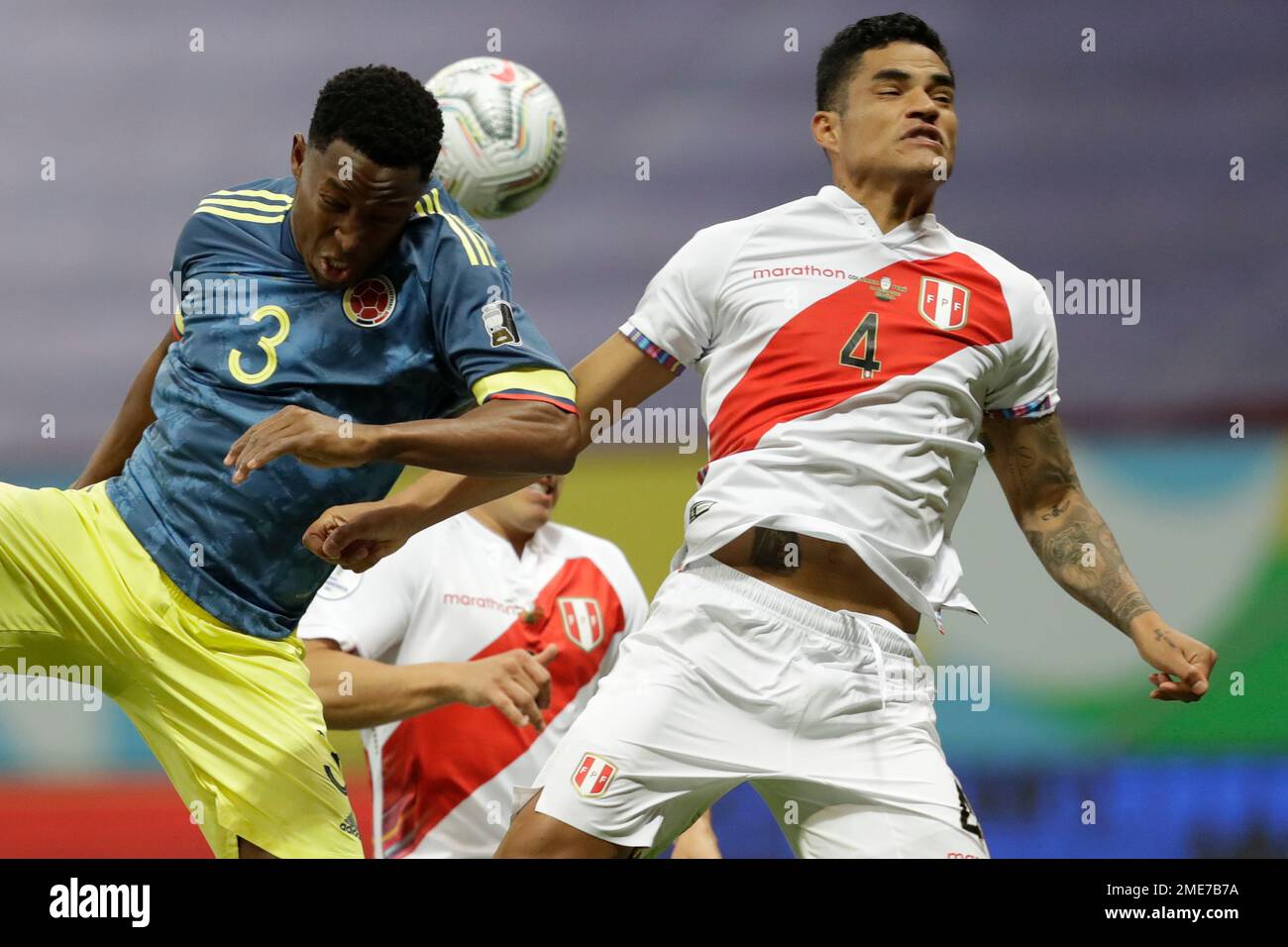 Colombia's Oscar Murillo, left, and Peru's Anderson Santamaria battle ...