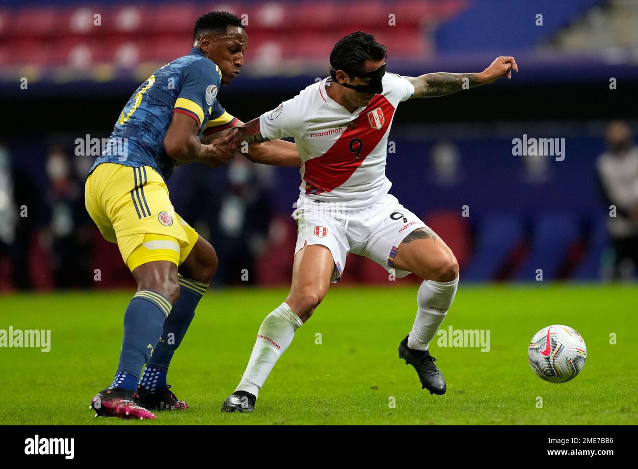 Peru's Gianluca Lapadula, right, and Colombia's Yerry Mina battle for ...
