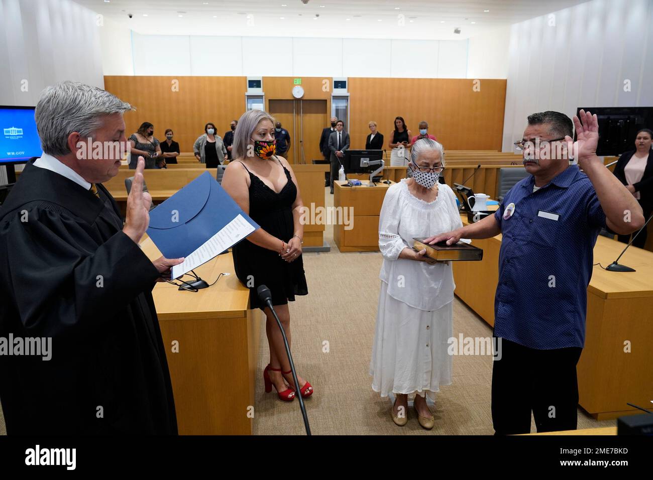 Judge Mark C. Scarsi administers the citizenship oath to U.S. Marine ...