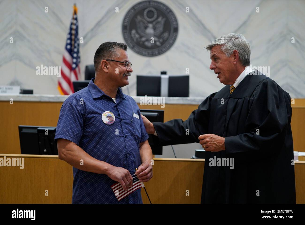 Judge Mark C. Scarsi, right, thanks U.S. Marine Corps Hector Ocegueda ...
