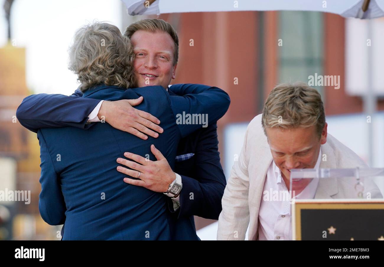 Television producer Nigel Lythgoe, left, embraces his son Kristopher at ...