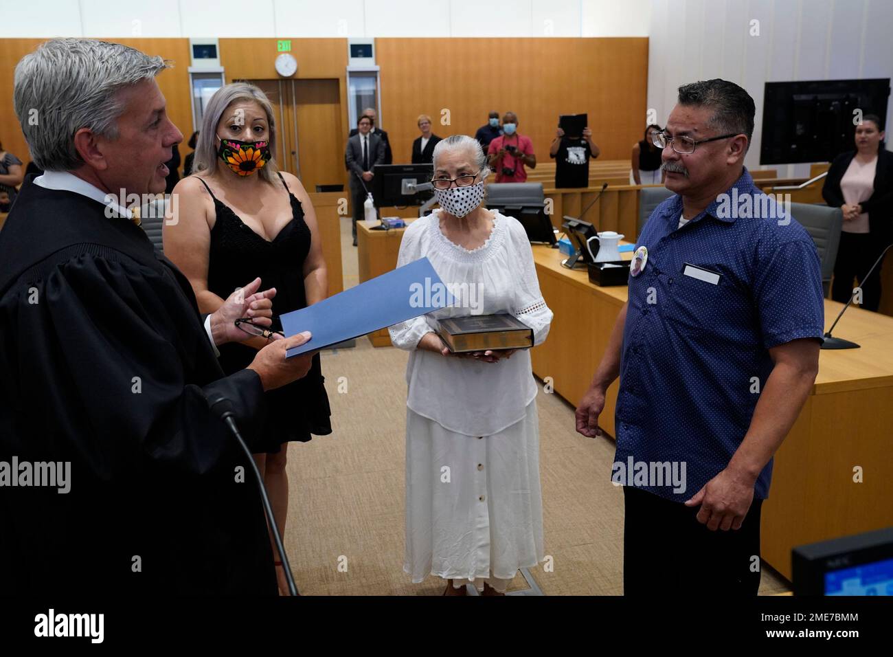 Judge Mark C. Scarsi, left, thanks U.S. Marine Corps Hector Ocegueda ...