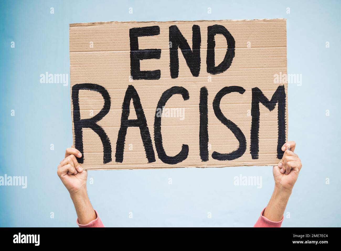 Hands, cardboard poster and end racism for protest, march or community ...