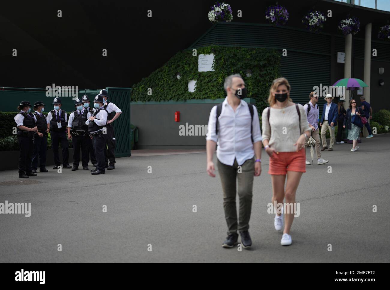 Police officers wearing face masks stand guard on day eleven of the ...