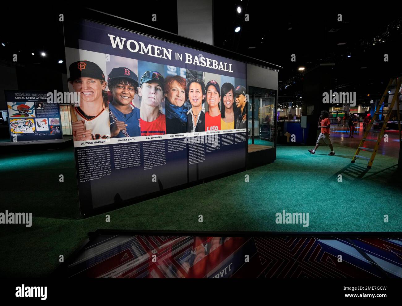 Finishing touches are applied on an exhibit highlighting women in ...