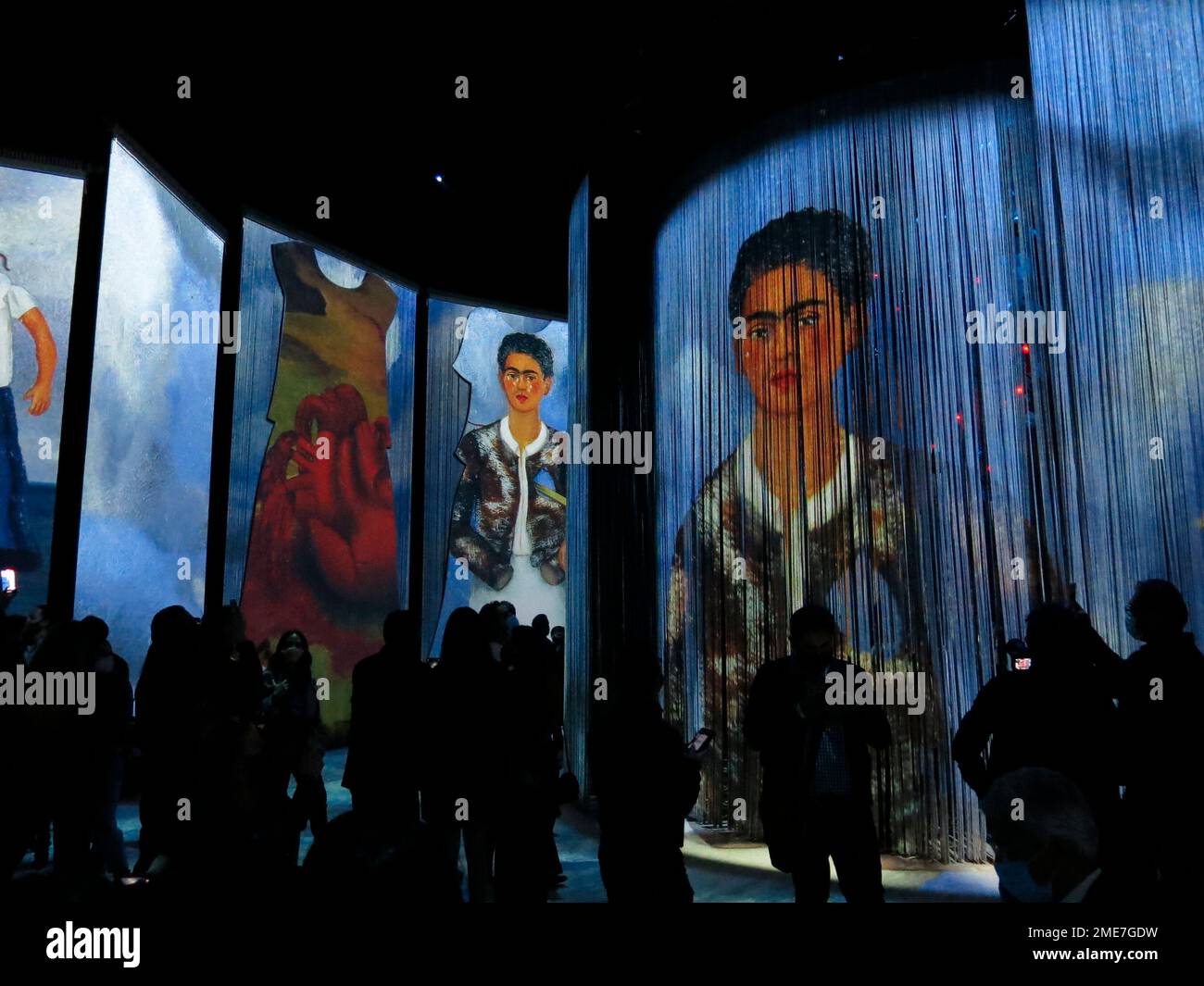 Visitors enjoy the inauguration of the immersive Frida Kahlo exhibit ...