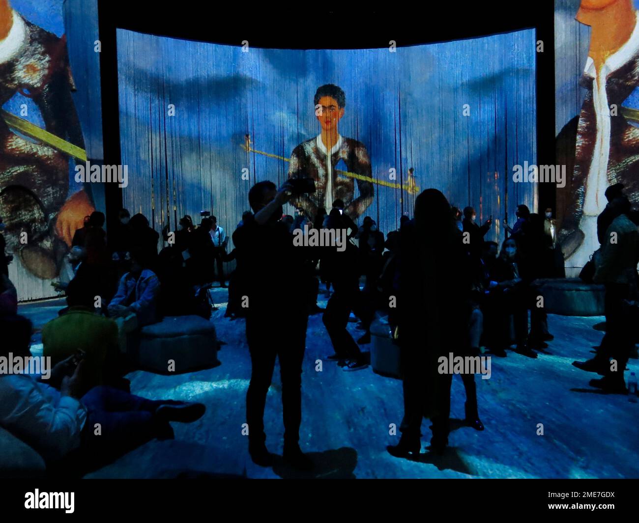 Visitors enjoy the inauguration of the immersive Frida Kahlo exhibit ...