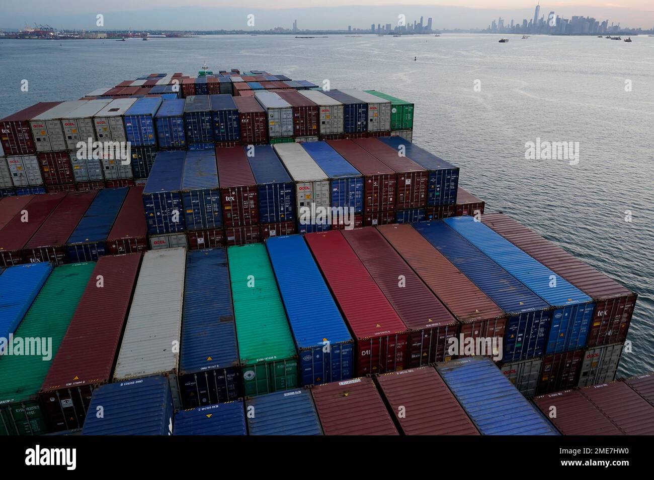 The Manhattan skyline is seen as a container ship makes its way through ...