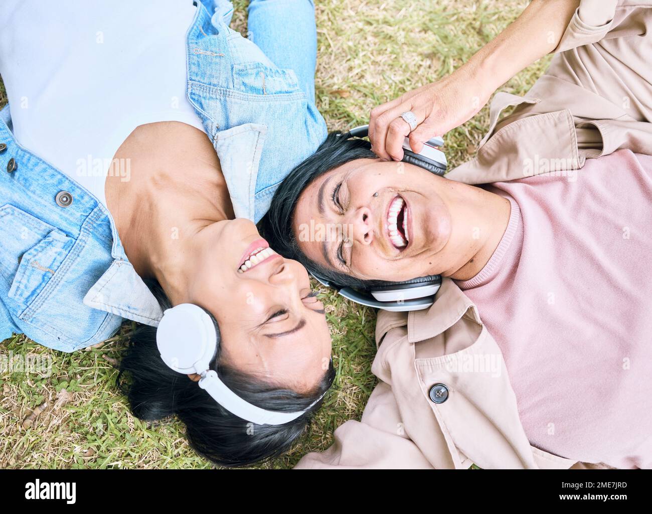 Face, friends and happy with women and headphones, listening to music ...