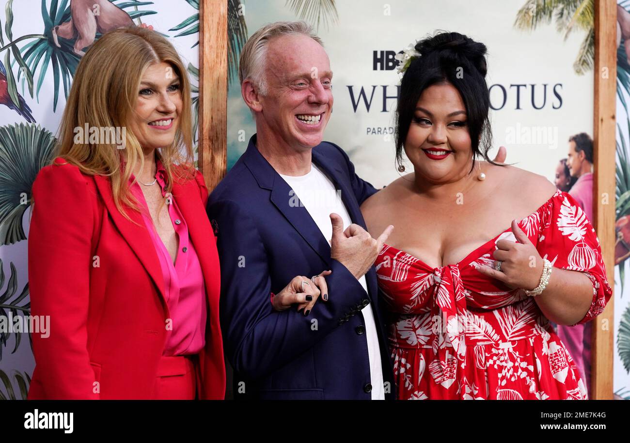 Mike White, center, writer/director of "The White Lotus," poses with ...