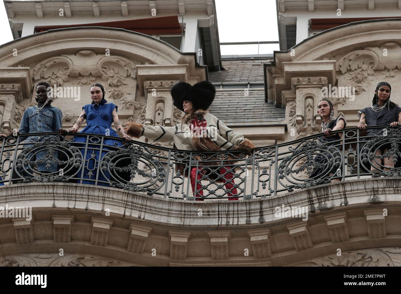 Models appear at a balconiy of Jean Paul Gaultier's fashion house after ...