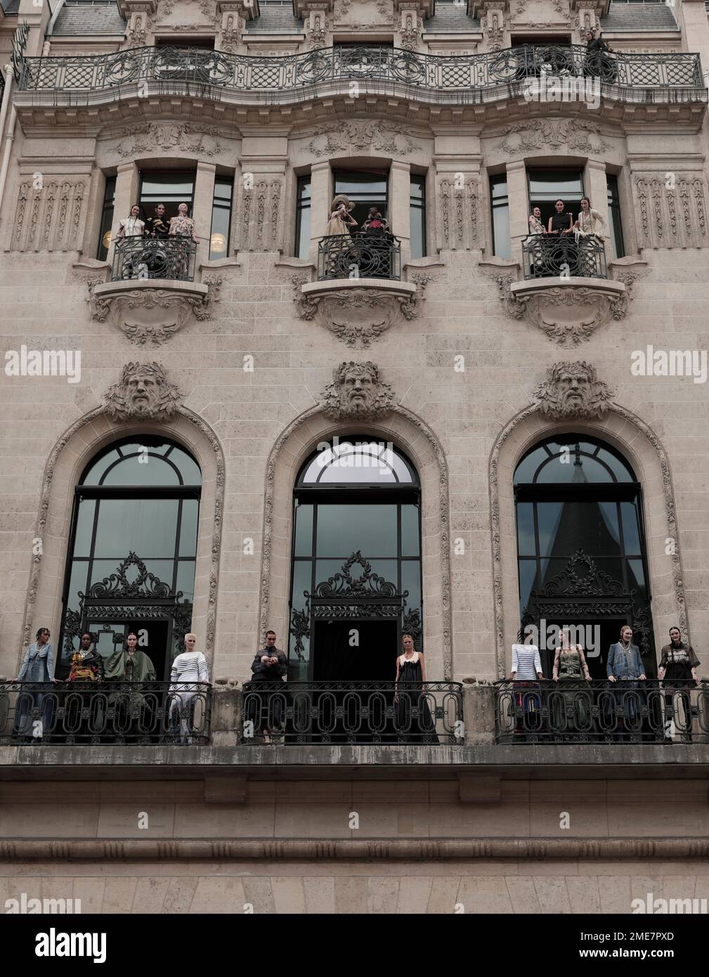 Models appear at the balconies of Jean Paul Gaultier's fashion house ...