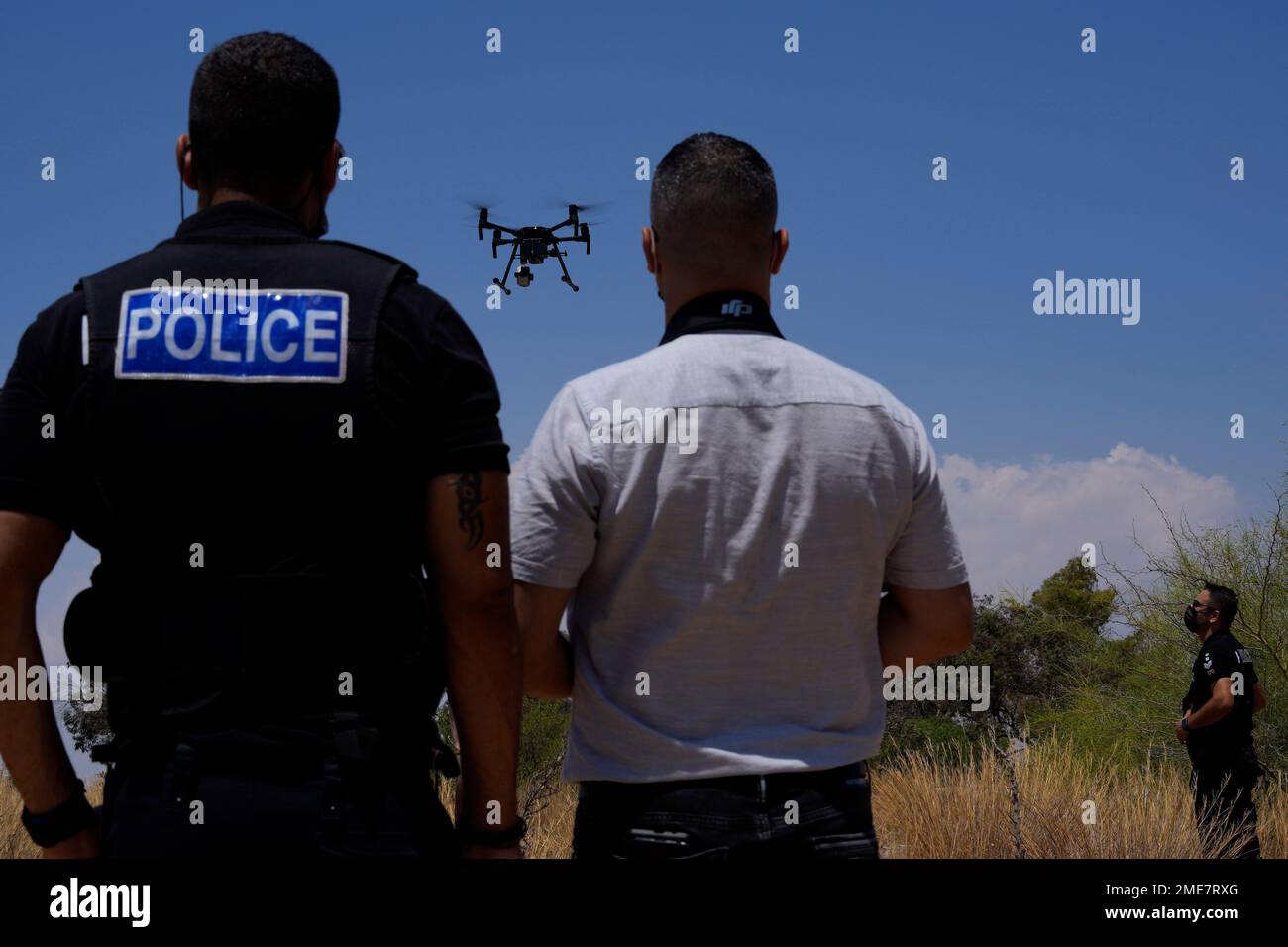 British police officers control a drone with cameras within the British ...