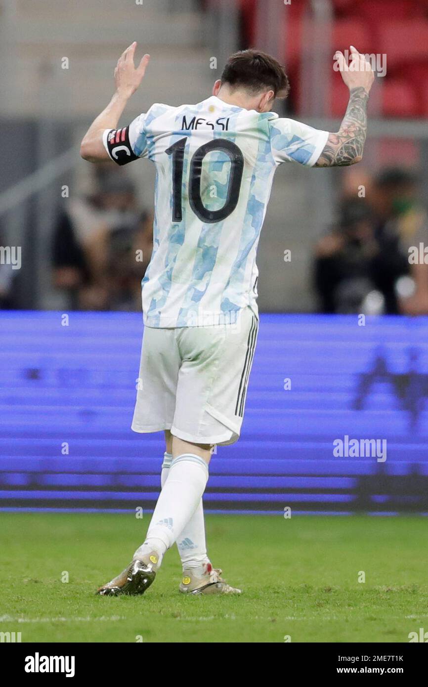 Blood is seen in an ankle of Argentina's Lionel Messi as he reacts ...