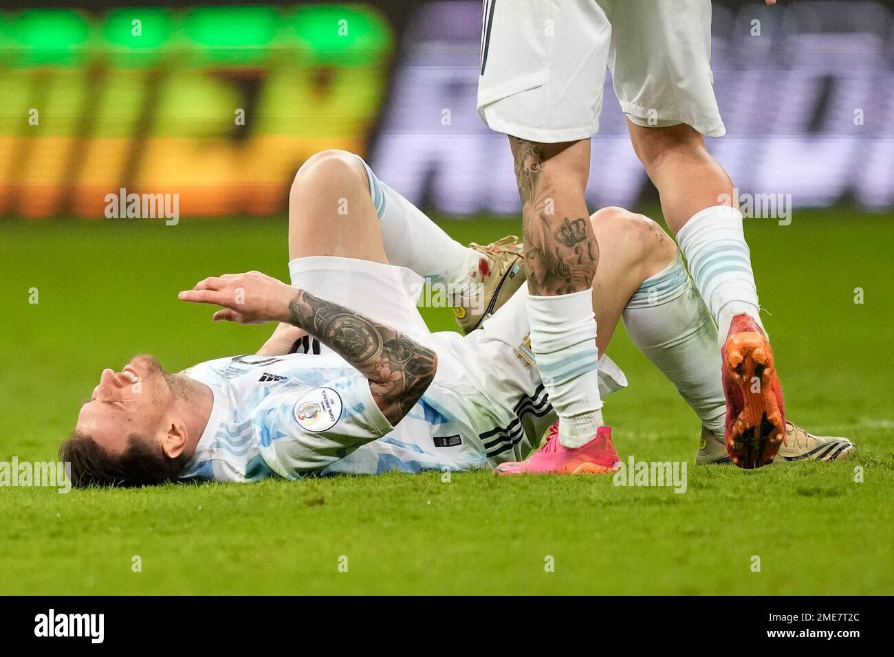 Argentina's Lionel Messi grimaces after being fouled during a Copa ...