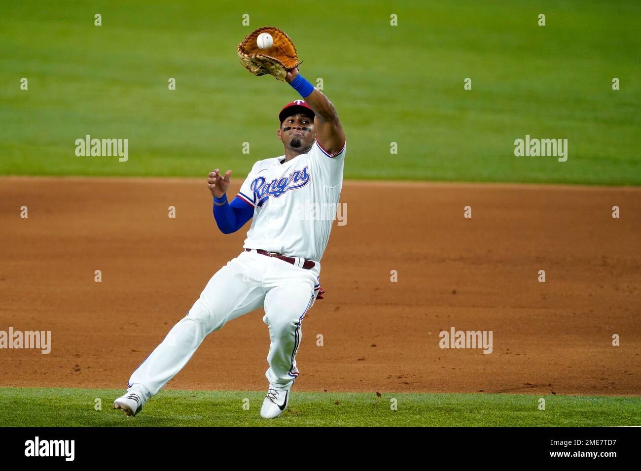 Texas Rangers first baseman Andy Ibanez fields a ball in the fifth ...